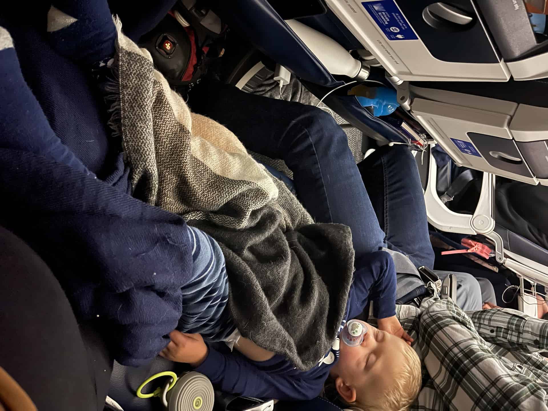 Top Tips to Help Your Toddler Sleep on a Plane - Rachel's Crafted Life
